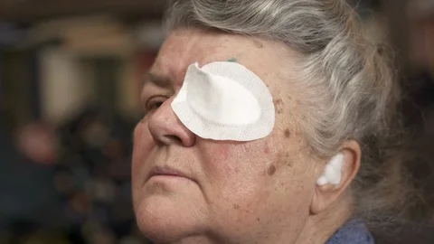 Old woman with protective eye patch afte... | Stock Video | Pond5