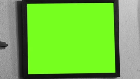 Old Wood Frame with Green Screen on Wall... | Stock Video | Pond5