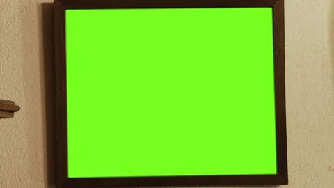 Old Wood Frame with Green Screen on Wall... | Stock Video | Pond5