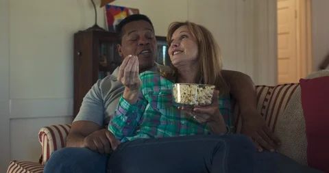 Older couple trying to catch popcorn in ... | Stock Video | Pond5