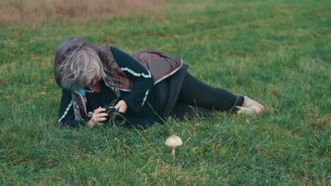 Older fat woman with grey hair lying on ... | Stock Video | Pond5