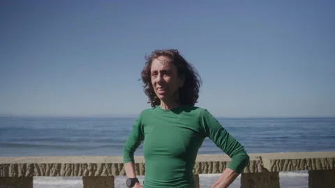 Older Fit Woman Looks Winded in Workout ... | Stock Video | Pond5