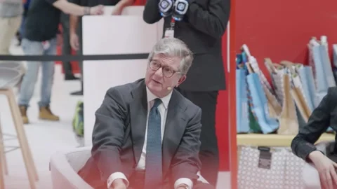 Older man, presenting slides at trade sh... | Stock Video | Pond5