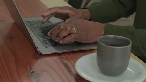 Older Man Working on a Computer in a Cof... | Stock Video | Pond5