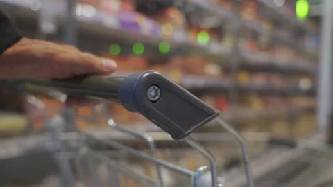 An older man's hand pushing a cart in a ... | Stock Video | Pond5