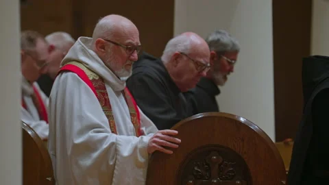 Older priest singing and praying during ... | Stock Video | Pond5