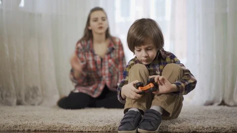 Older sister scolds younger brother who ... | Stock Video | Pond5