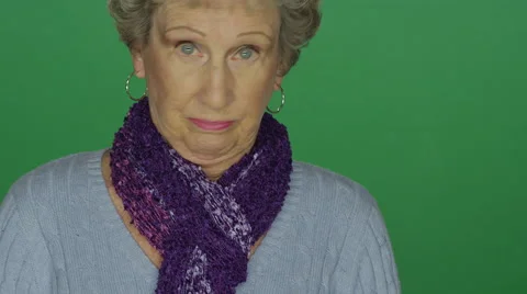 Older woman shaking her head no, on a gr... | Stock Video | Pond5