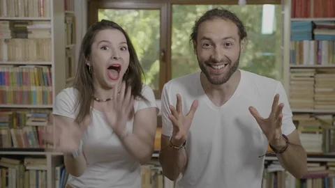 Omg reaction of excited young couple at ... | Stock Video | Pond5