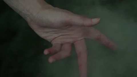 ominous hand in smoke steam slow motion | Stock Video | Pond5