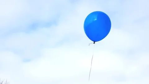 One blue balloon on a string, flying in ... | Stock Video | Pond5