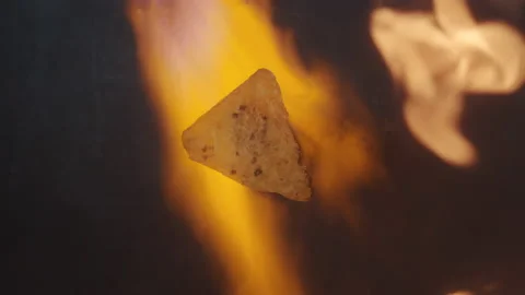 One doritos chips burned by the flame o... | Stock Video | Pond5