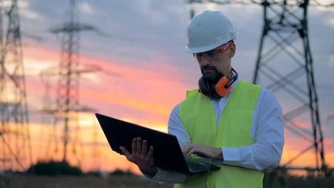 One engineer types on a laptop. Stands n... | Stock Video | Pond5