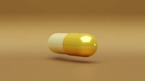 One golden shining capsule pill - Medici... | Stock Video | Pond5