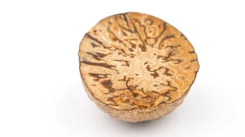 One half cut nutmeg. Cross section. Quic... | Stock Video | Pond5