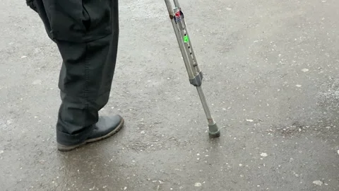 one-legged disabled man walk with crutch... | Stock Video | Pond5