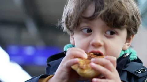 One little boy snacking croissant, child... | Stock Video | Pond5