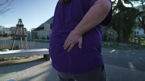 One overweight man suffering from back p... | Stock Video | Pond5