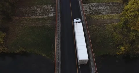 One Semi Truck with white trailer and ca... | Stock Video | Pond5