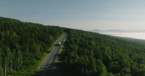 One Semi Truck with white trailer and ca... | Stock Video | Pond5