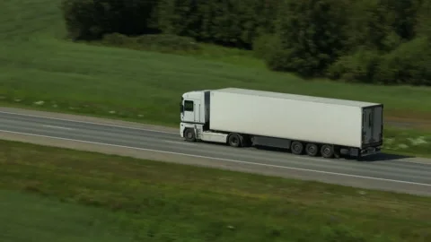 One Semi Truck with white trailer and ca... | Stock Video | Pond5