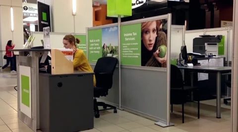 One side of H&R Block inside shopping ma... | Stock Video | Pond5