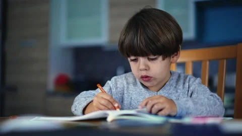 One small boy drawing at home. Child doi... | Stock Video | Pond5