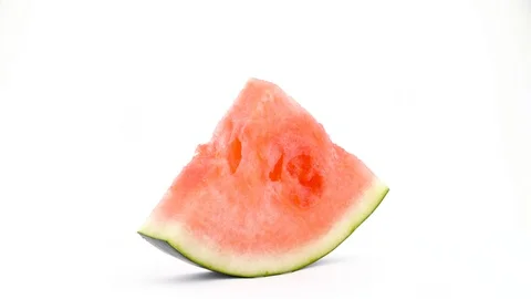 One watermelon slice. Slowly rotating on... | Stock Video | Pond5