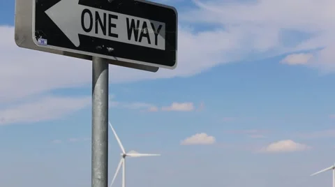 One Way Road Sign with Wind Turbine Blad... | Stock Video | Pond5