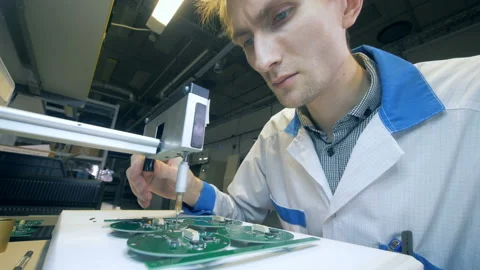 One worker welds chip, microcircuit, mic... | Stock Video | Pond5