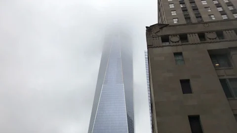 One World Trade Center behind fog in sky | Stock Video | Pond5