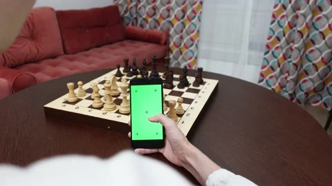 Online chess game. Phone with green scre... | Stock Video | Pond5