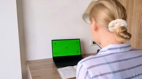 Online learning. Back view of woman look... | Stock Video | Pond5