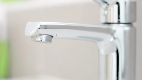 Open and close water faucet in the sink ... | Stock Video | Pond5