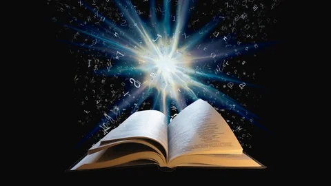 Open Bible with light and letters flying... | Stock Video | Pond5