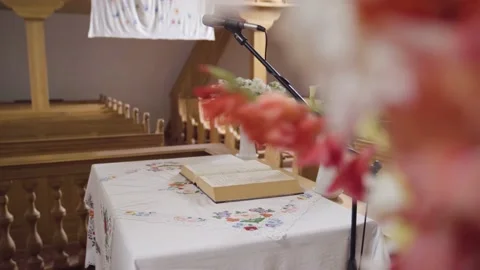 Open Bible on small table in church reve... | Stock Video | Pond5