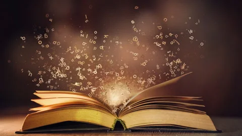 Open book with letters falling into the ... | Stock Video | Pond5