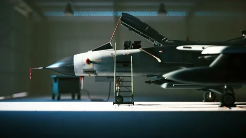 Open cockpit of a fighter jet in the han... | Stock Video | Pond5