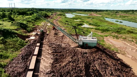 Open-pit mining. Dragline excavator load... | Stock Video | Pond5