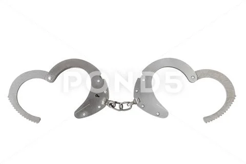 Opened handcuffs in the form of hearts, on a white isolated background ...