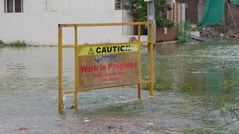 opened manhole with caution sign board d... | Stock Video | Pond5
