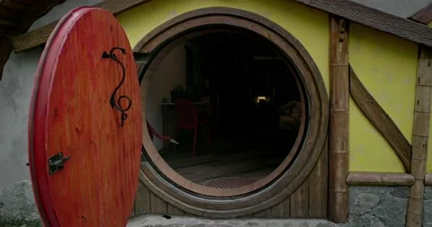 Opening the door of the hobbit house. Ho... | Stock Video | Pond5