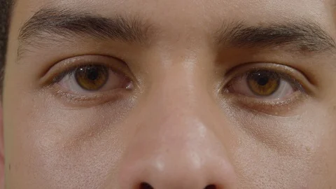 opening the eyes wide open by a young bo... | Stock Video | Pond5