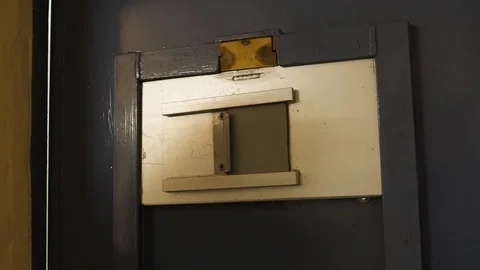Opening jail cell door observation windo... | Stock Video | Pond5