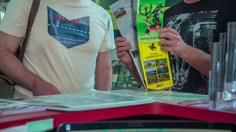 Opening the map to show something to the... | Stock Video | Pond5