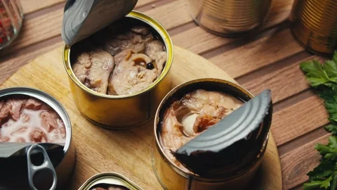Opening metal cans with canned fish and ... | Stock Video | Pond5