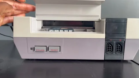 Opening an original Nintendo console wit... | Stock Video | Pond5