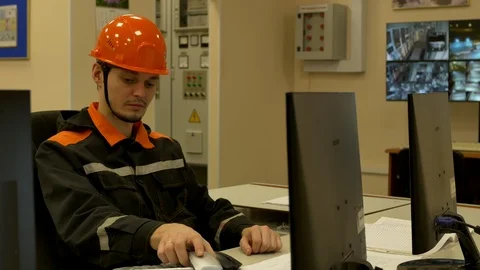 the operator in the helmet sitting in th... | Stock Video | Pond5