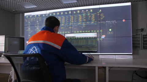 Operator works on computer in control ro... | Stock Video | Pond5