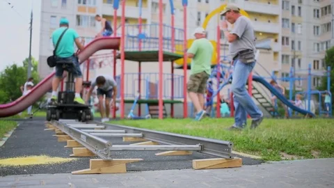 Operator works on dolly rail during film... | Stock Video | Pond5
